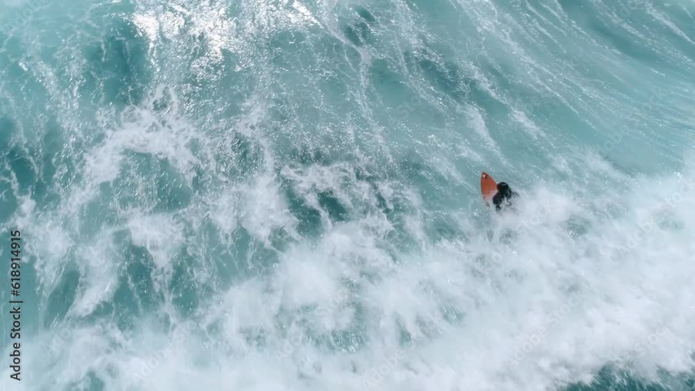 Top aerial view: surfing concept, summer travel. Blue ocean and one man ...