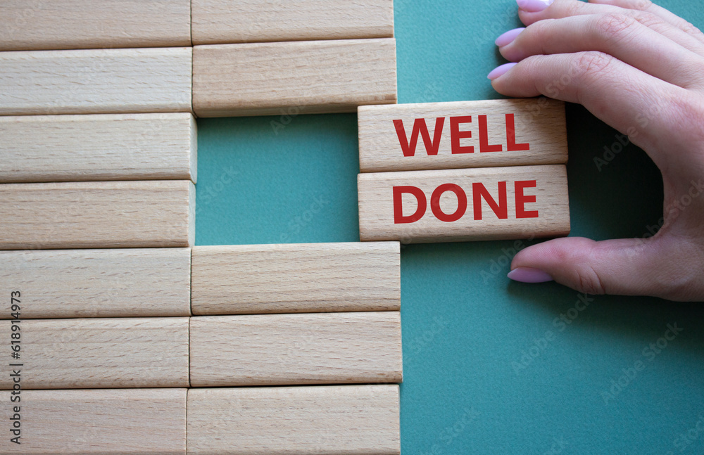 Well done symbol. Wooden blocks with words Well done. Beautiful grey ...