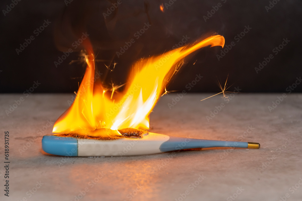 Electronic thermometer fire, flames, flames and sparks. Short circuit ...