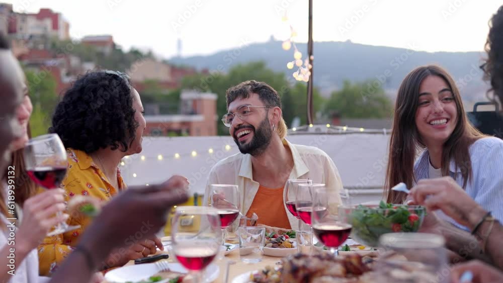 Vídeo do Stock: Diverse happy friends having dinner party outside ...