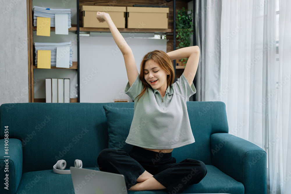 Woman is doing a stretchy posture due to sitting in the home office for ...