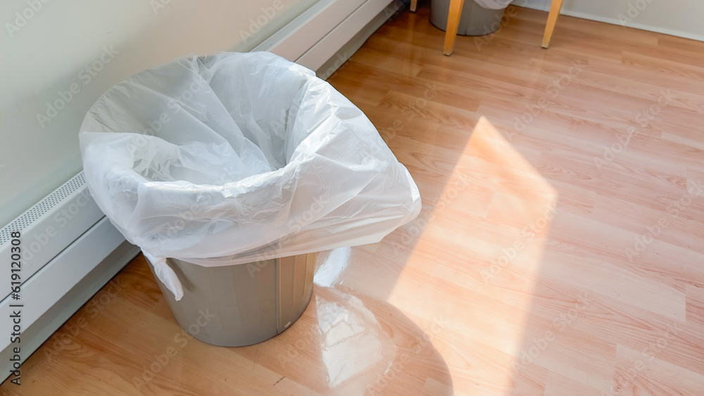 plastic-filled trashcan, symbolizing the detrimental impact of plastic ...