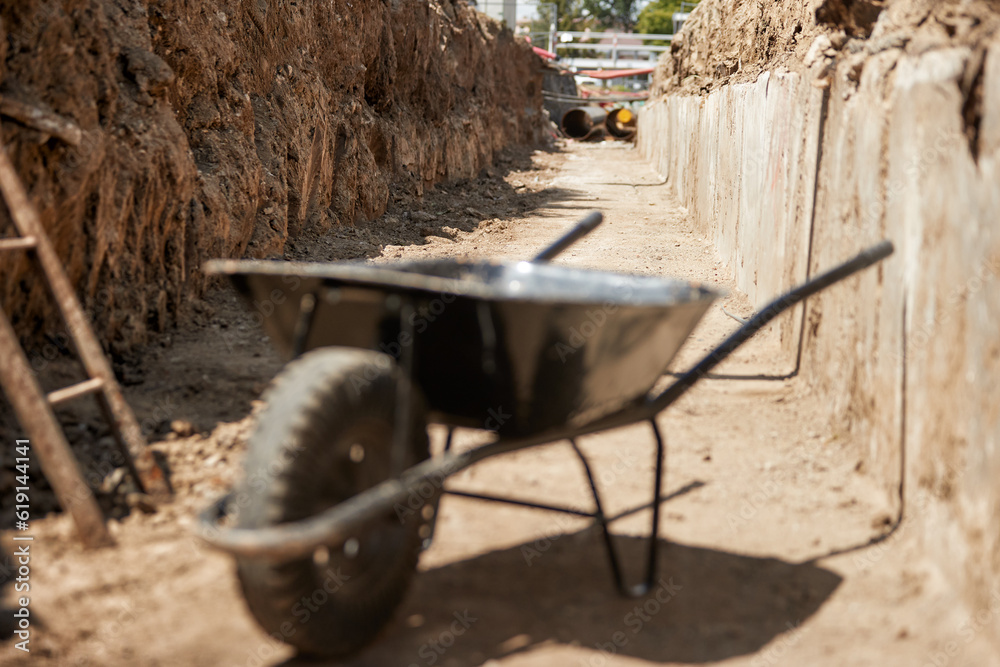 Wheelbarrow in concrete collector, preparation of pre-insulated pipe ...