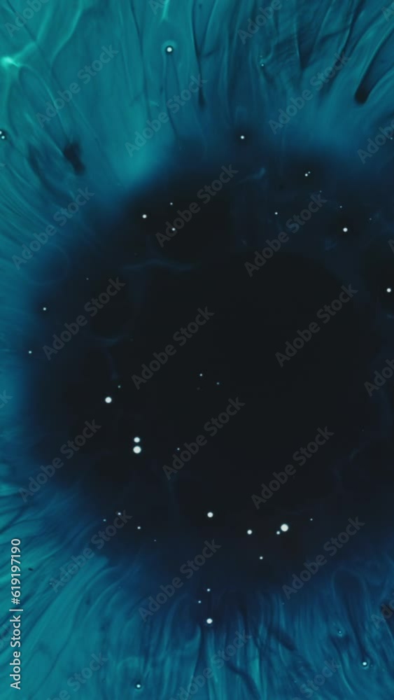 Vertical video. Paint water splash. Space hole. Ink design. Blue fluid ...