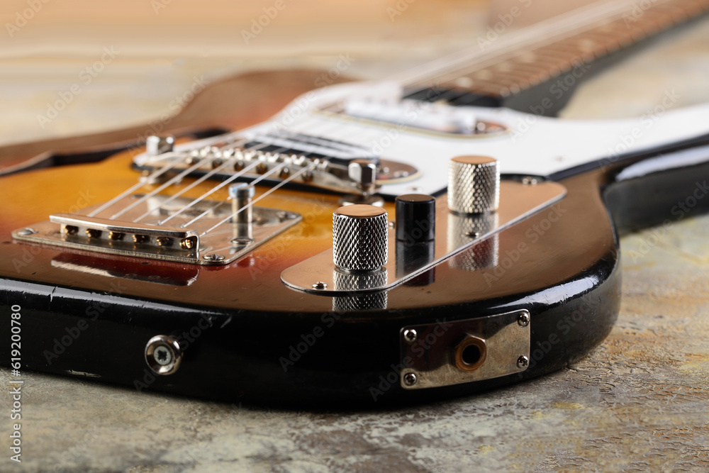 Vintage electric guitar telecaster's form on plastered background ...