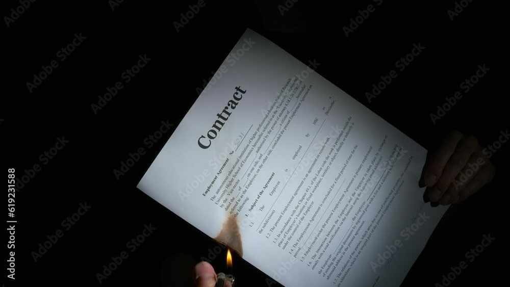 Burn the contract on black background. A view of burning contract ...
