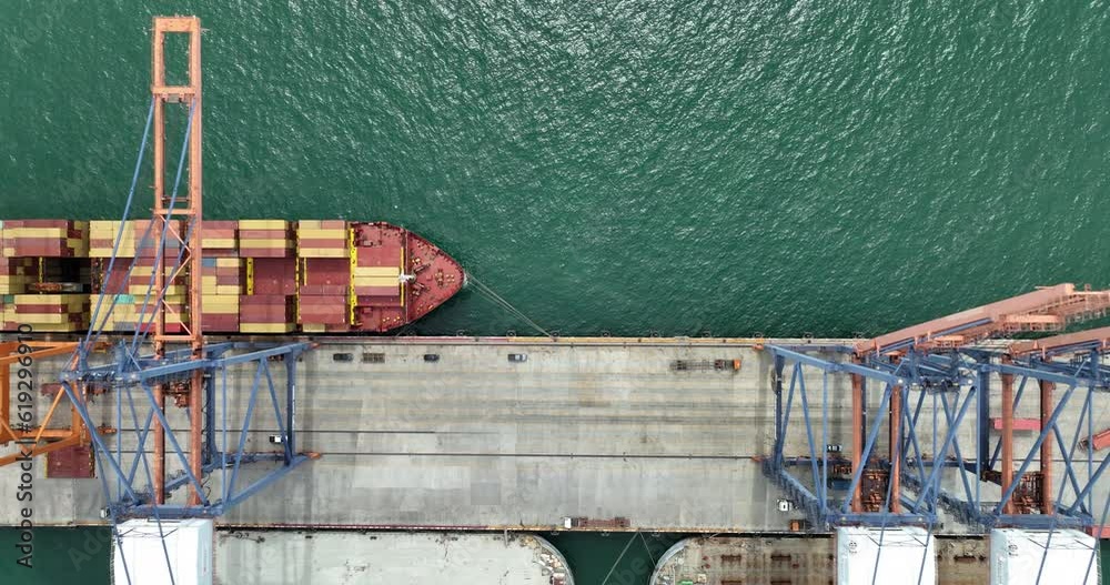 container ship and commercial port loading and unloading cargo from ...