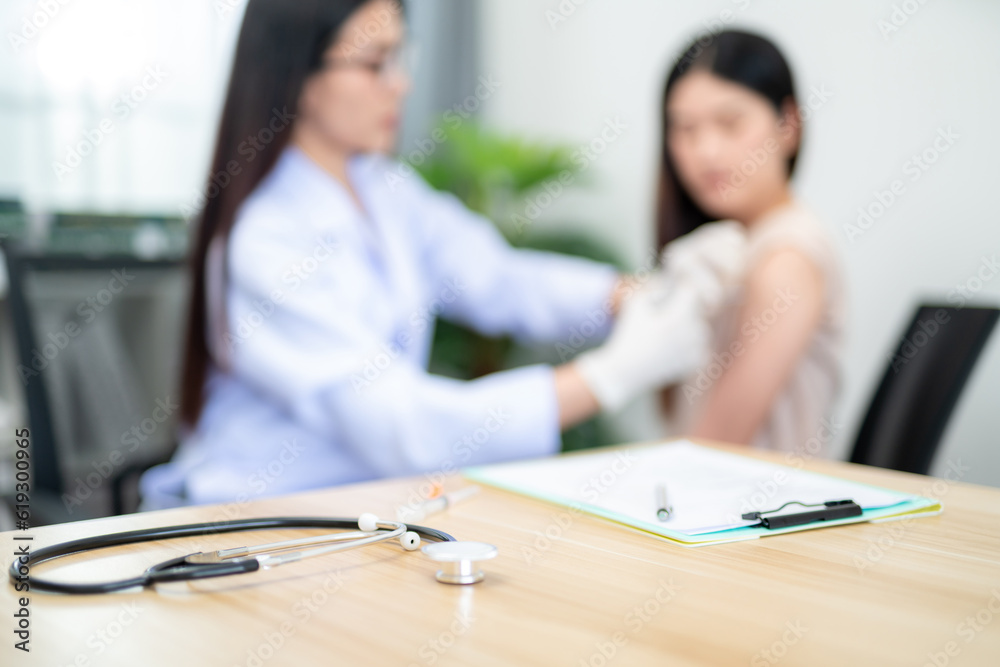Blurred of Doctor making a vaccination in the shoulder of patient, Flu ...