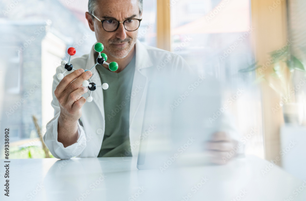 Mature scientist researching on molecular structure in laboratory Stock ...