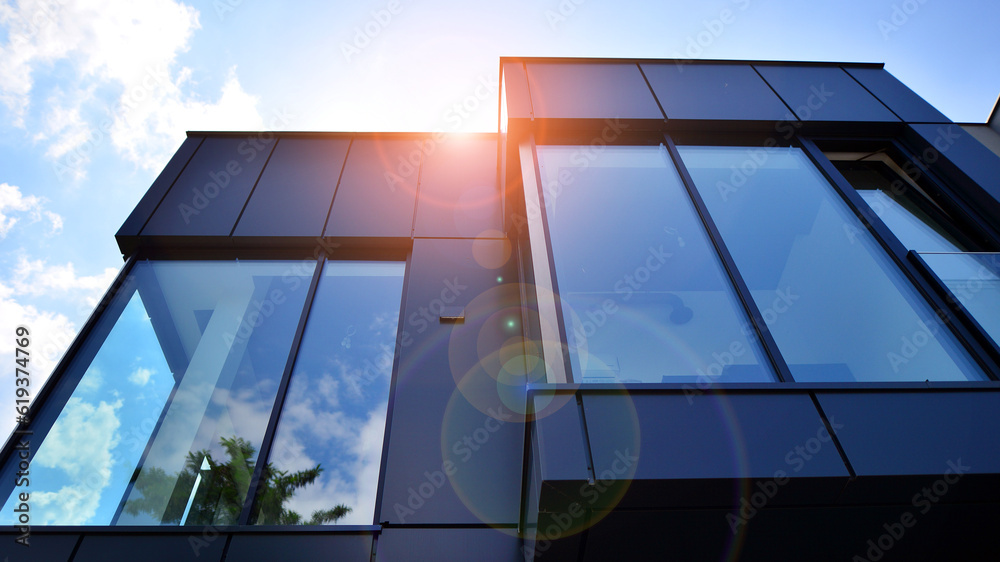 Graphite facade and large windows on a fragment of an office building ...