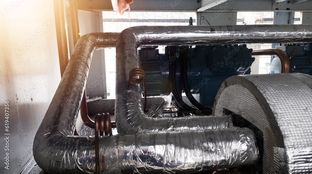Evaporator pipe line on a chiller machine wrapped with an air damper ...