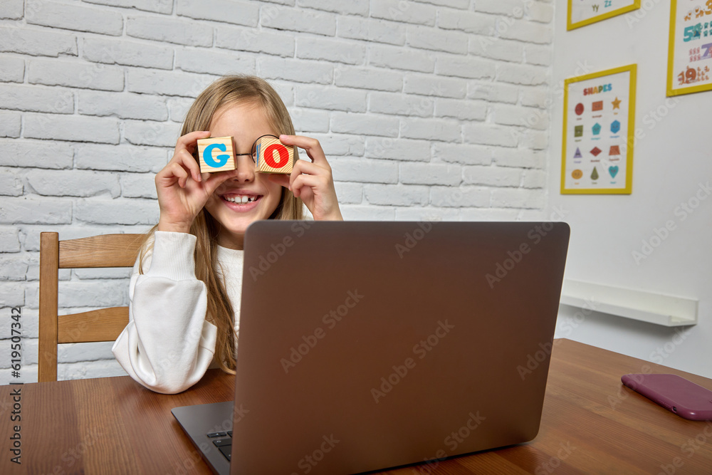 English lesson in a cozy study with a white brick wall. At a brown ...