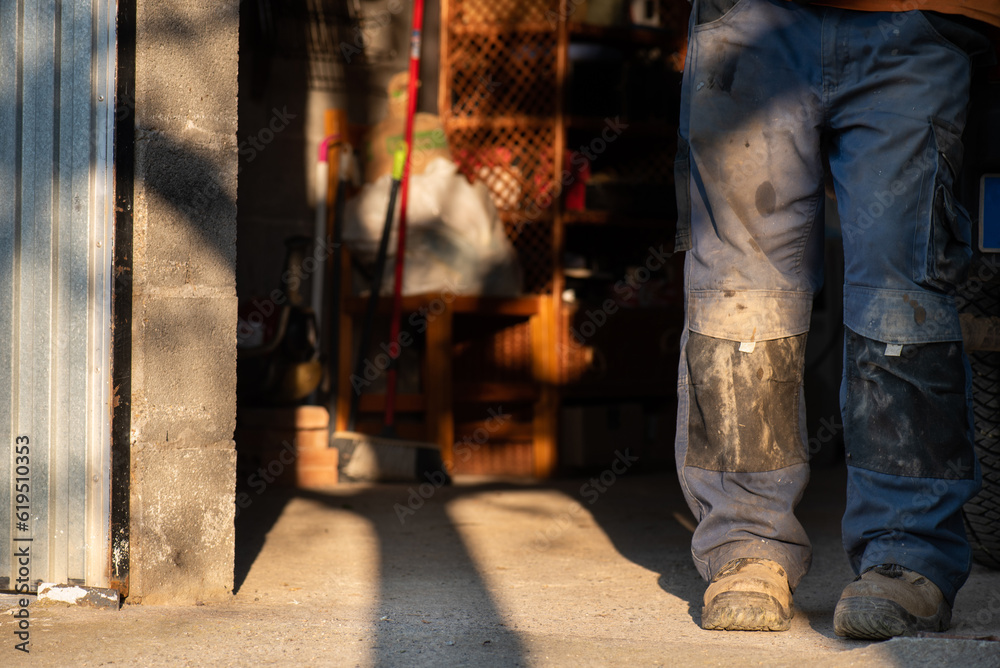 dirty trousers of worker in protective boots for occupational hazards ...