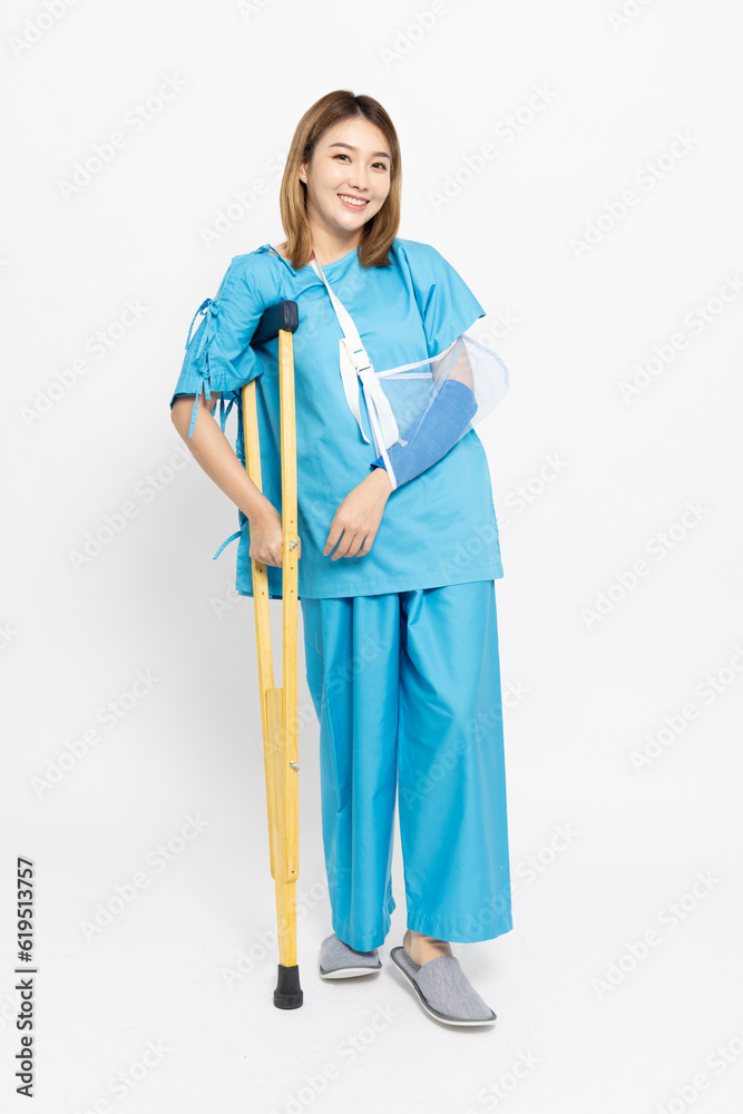 Young Asian woman wearing patient outfits and put on a soft splint due ...