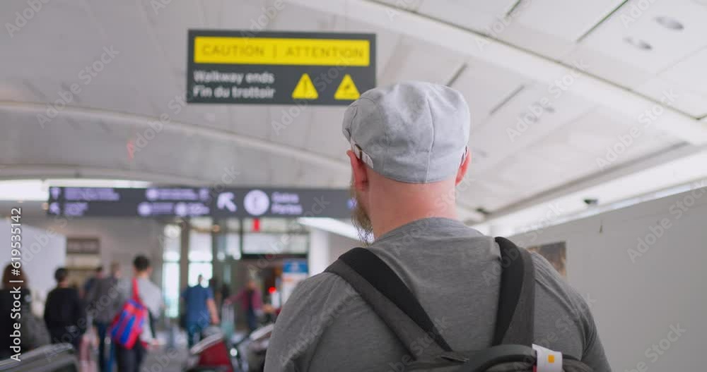 Close-up cinematic shot airport passengers going to exit along ...