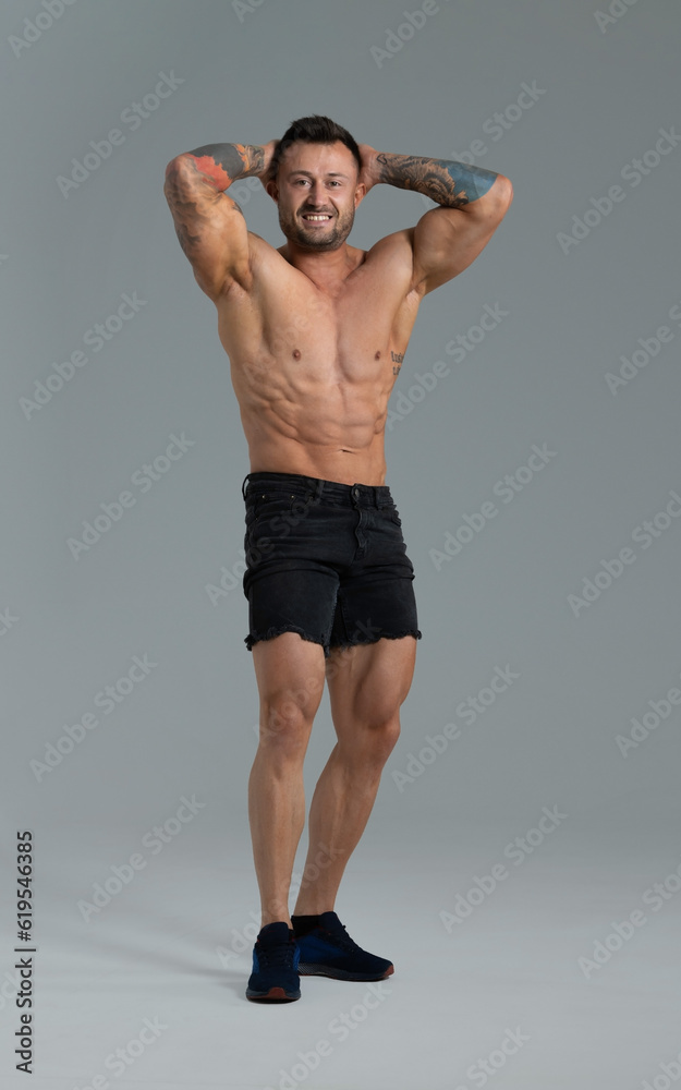 Vertical banner, photo of a male bodybuilder with developed body ...