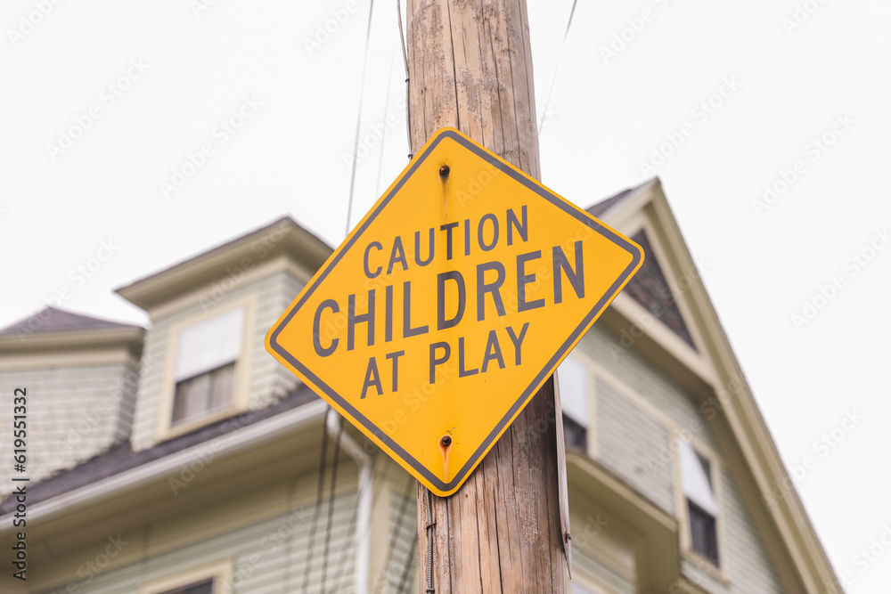 yellow pedestrian sign stands tall on a busy street, symbolizing safety ...