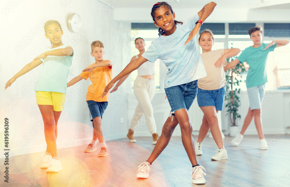 Portrait of expressive happy african-american tween boy practicing ...
