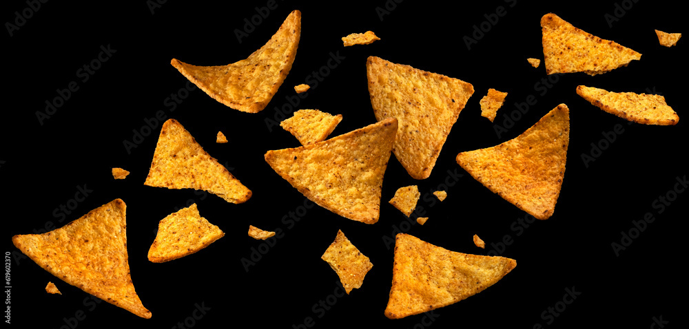 Falling corn chips, hot Mexican nachos isolated on black background ...