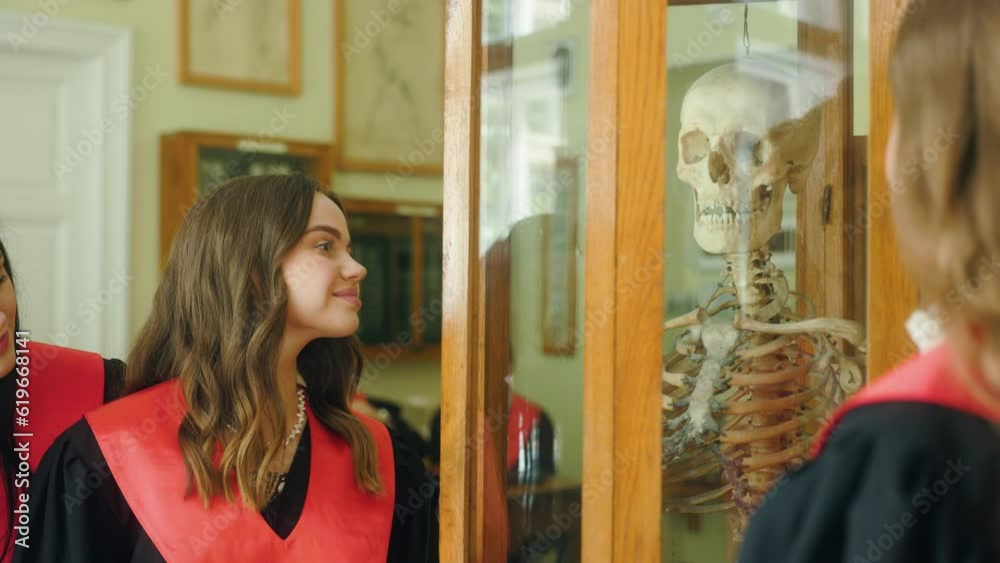 Medical Students celebrate graduation. Young people dressed in gowns ...