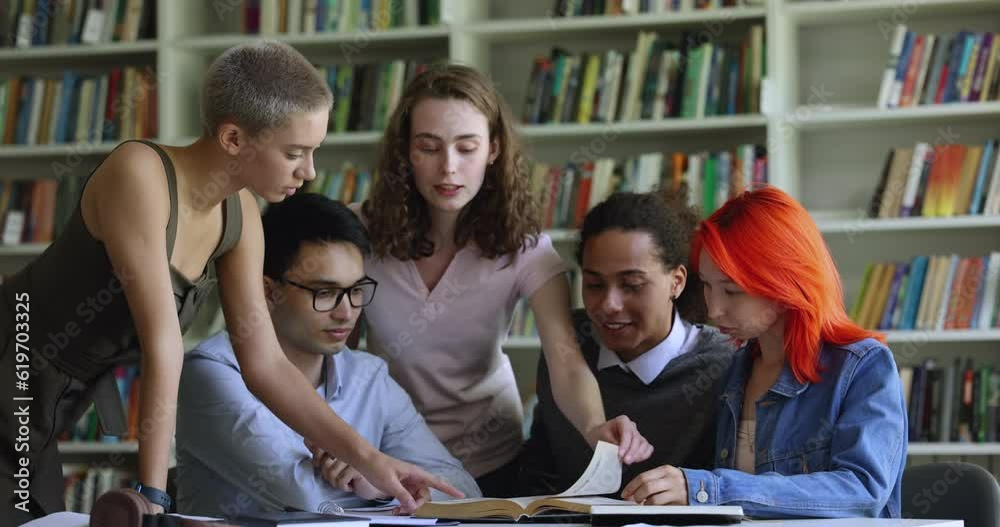 Students group serious leader explaining book to diverse classmates ...