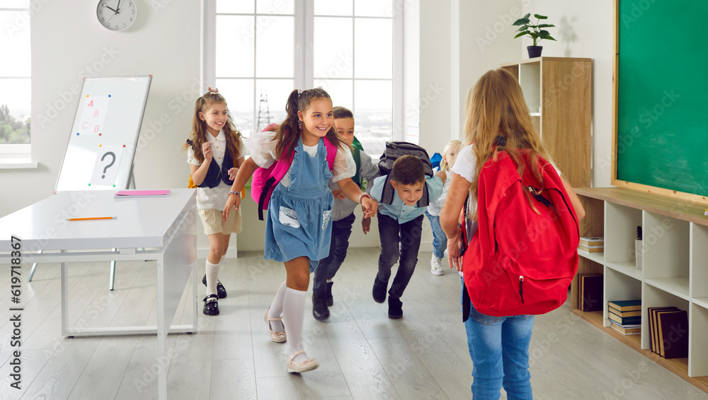 Funny elementary school students having fun and fooling around together ...