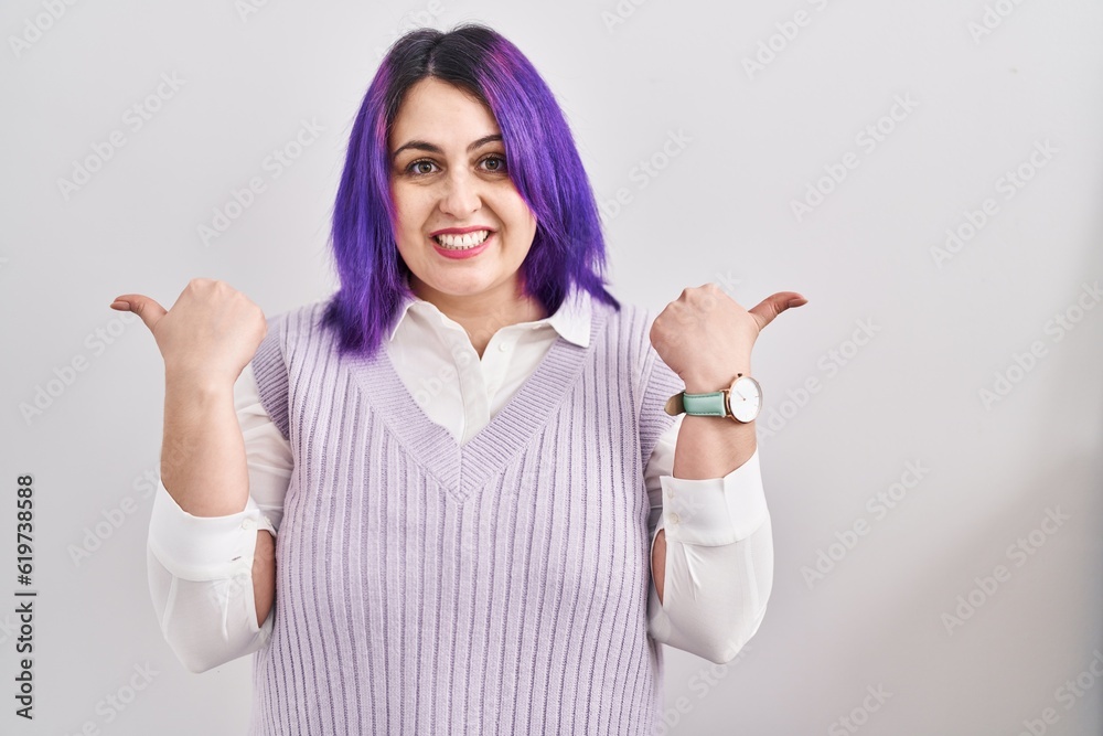 Plus size woman wit purple hair standing over white background success ...