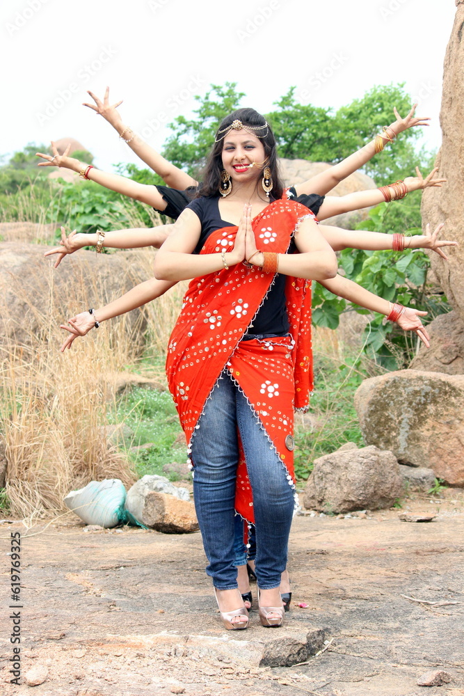 group of girls forming a dance pose of praying god with single body and ...