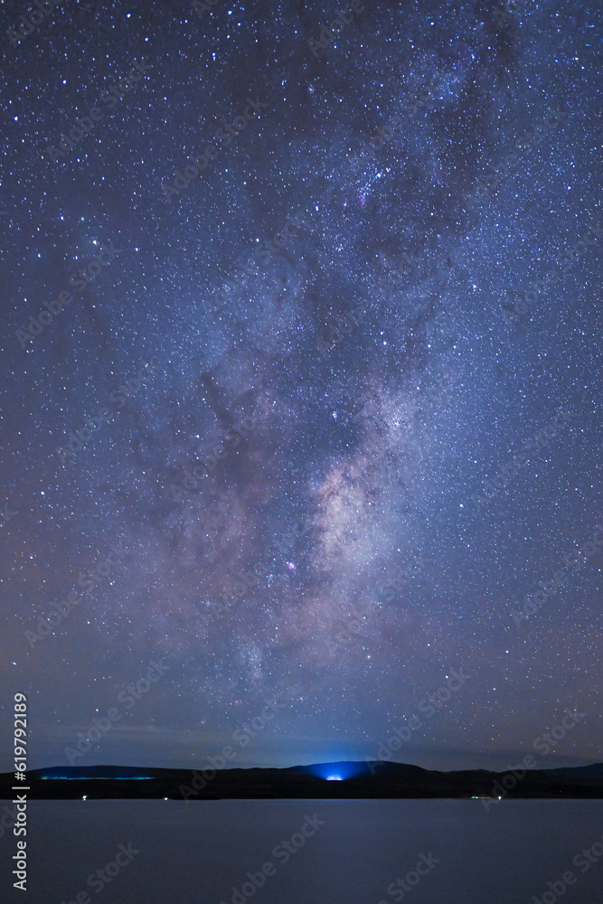 The milky way rises in the night sky over Lake Tekapo. Stock Photo ...