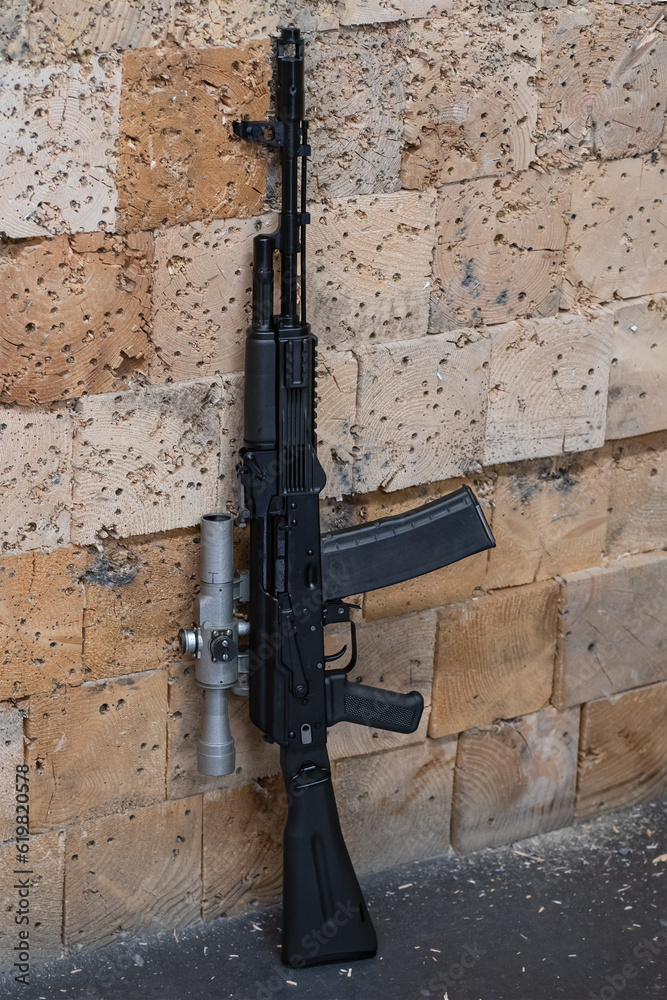 Assault rifle ak74m with a optical sight in a shooting range near the ...