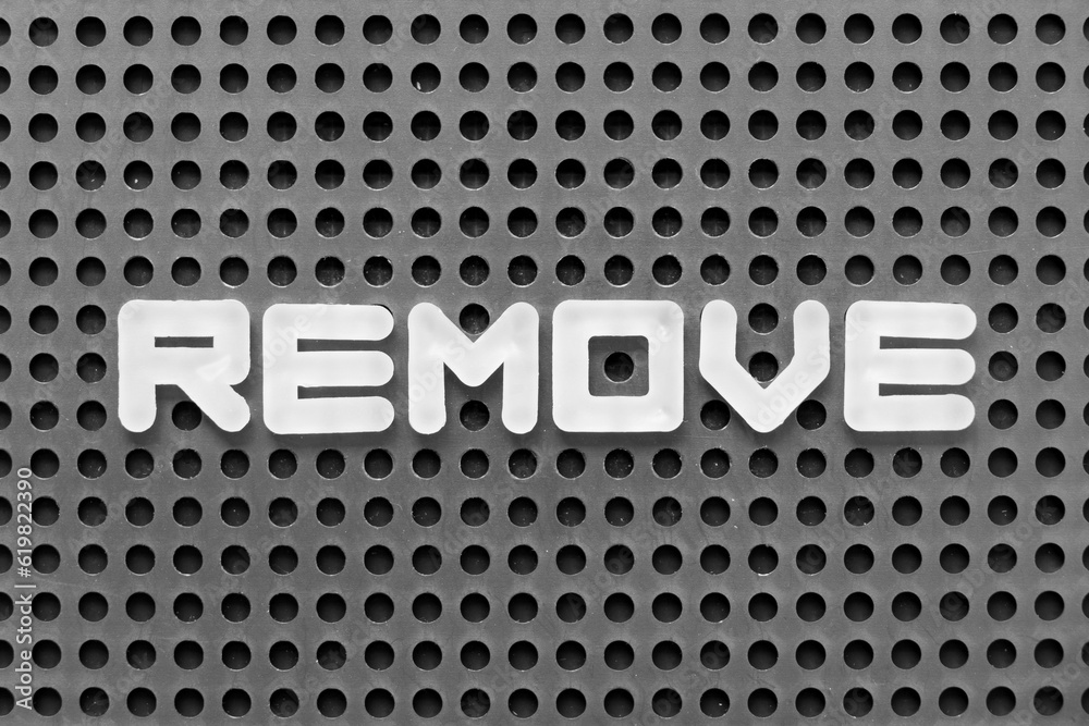 White alphabet letter in word remove on black pegboard background Stock ...