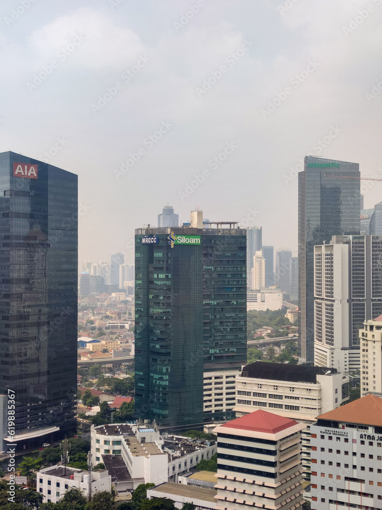 Jakarta cityscape with AIA red white and Siloam Hospital MRCCC and ...