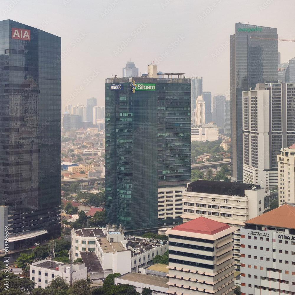 Jakarta cityscape with AIA red white and Siloam Hospital MRCCC and ...