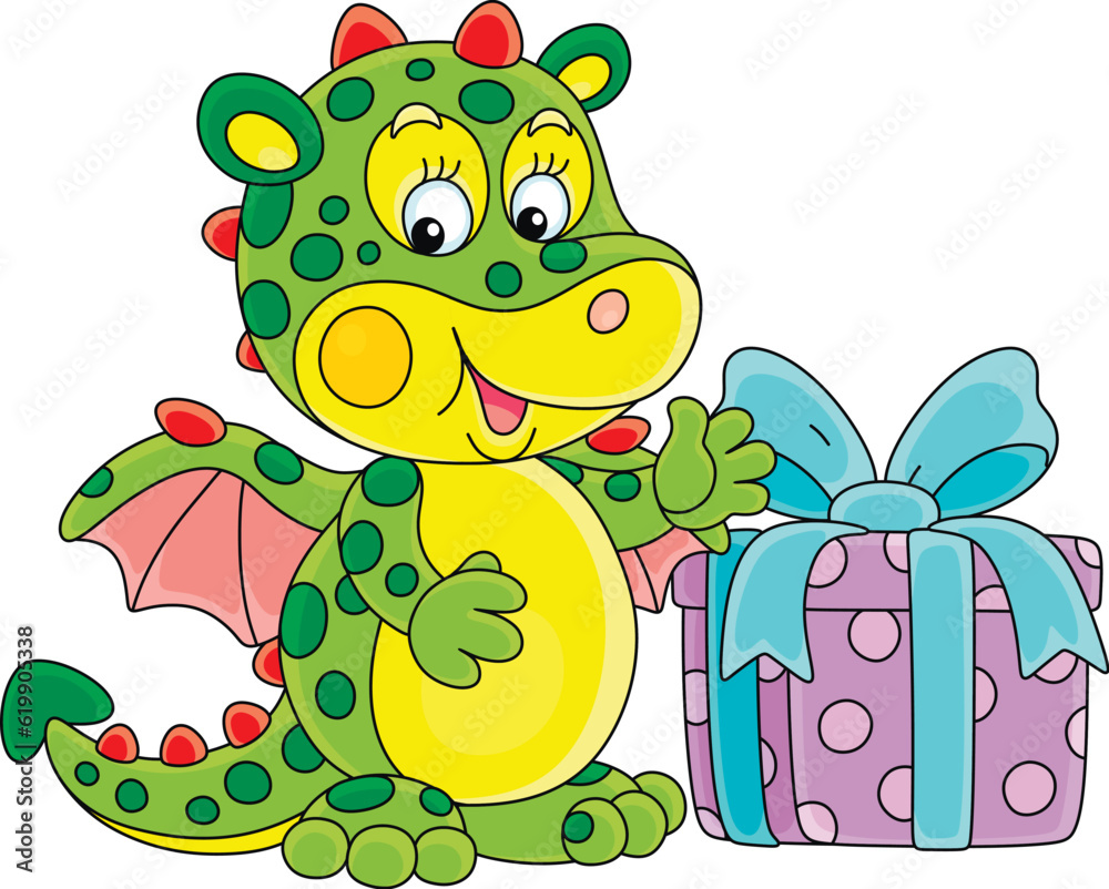 Happy little toy dragon and a holiday sweet gift box decorated with a ...