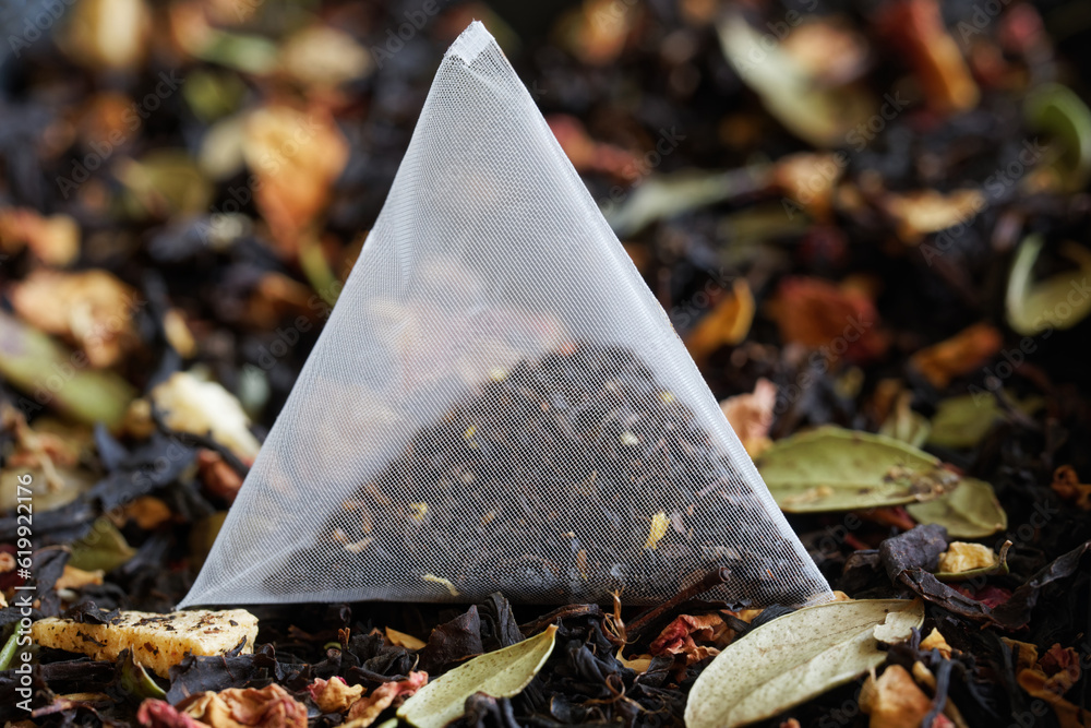 Tea bag-pyramid with black flavored tea, with the addition of fruits ...