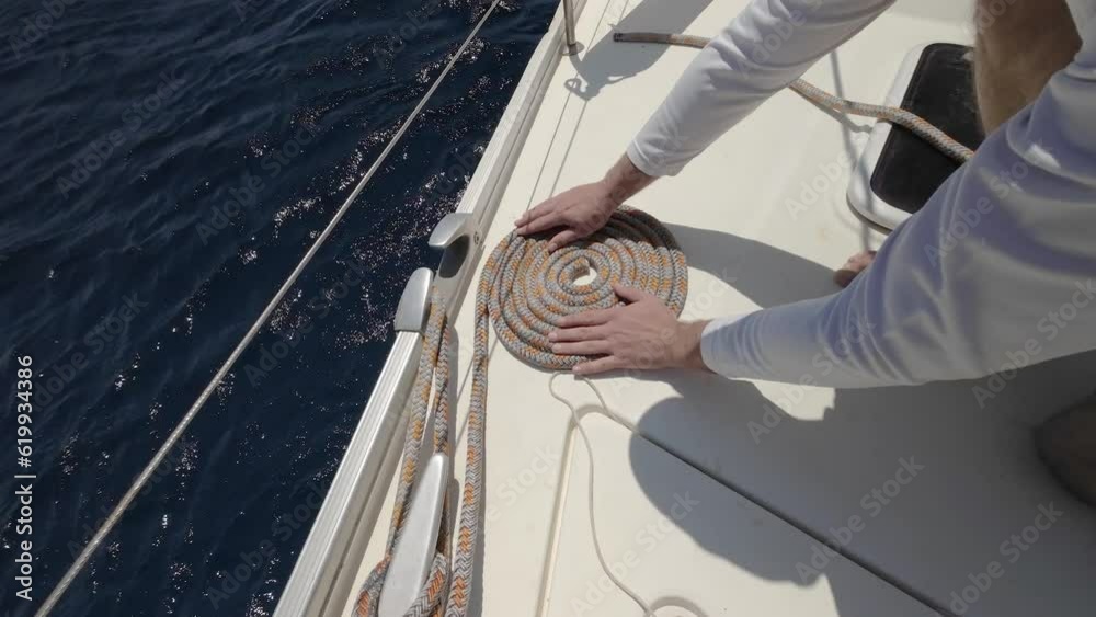 Close-up footage of sailboat ropes, pulleys and ropes on the mast. A ...