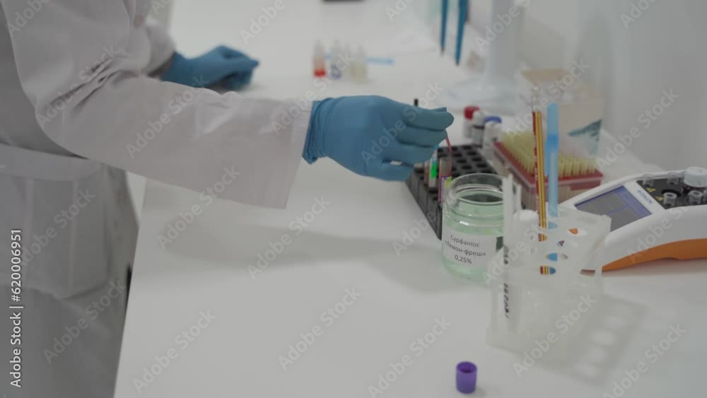 Laboratory determination of blood type. Blood test. Female laboratory ...