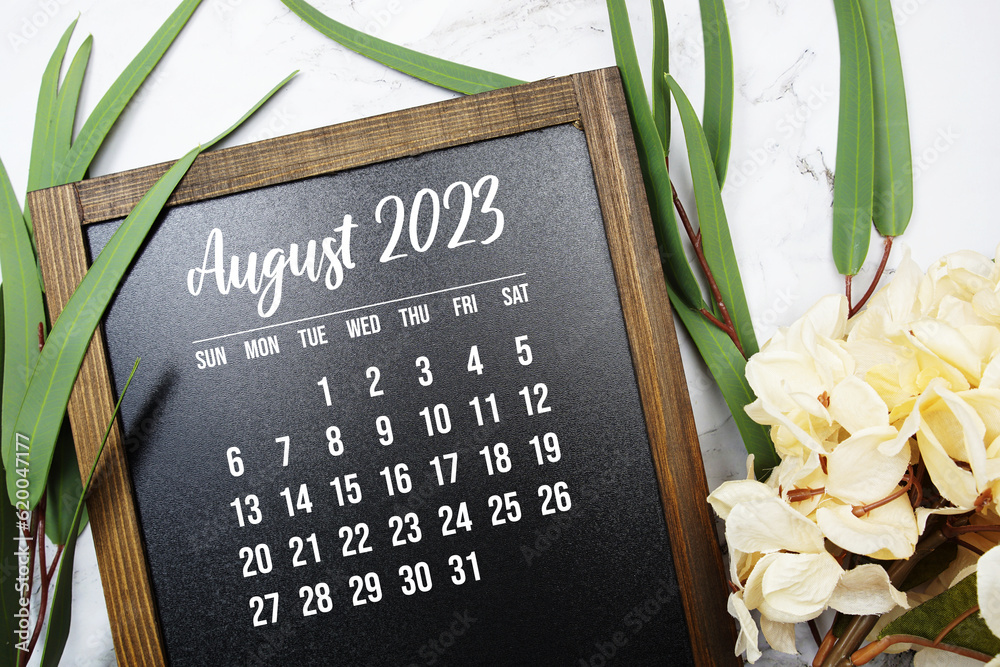 August 2023 monthly calendar with flower bouquet decoration on marble ... August 2023 monthly calendar with flower bouquet decoration on marble ...