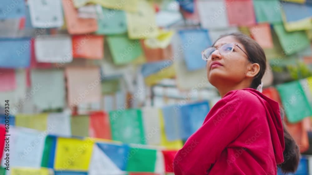 Portrait of Indian female tourist and colorful Buddhist Prayer flags in ...