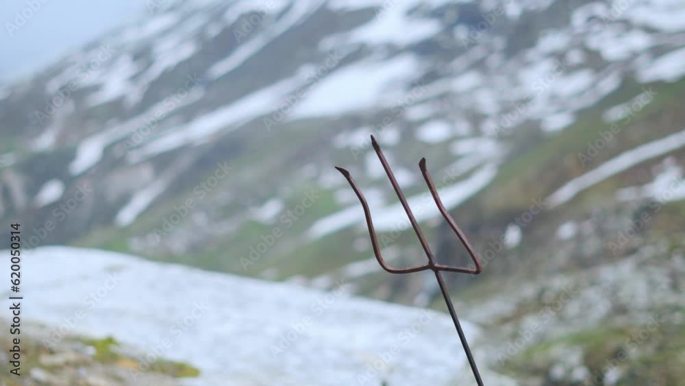 Shiva Trishul in background of snow covered Himalaya mountains at ...