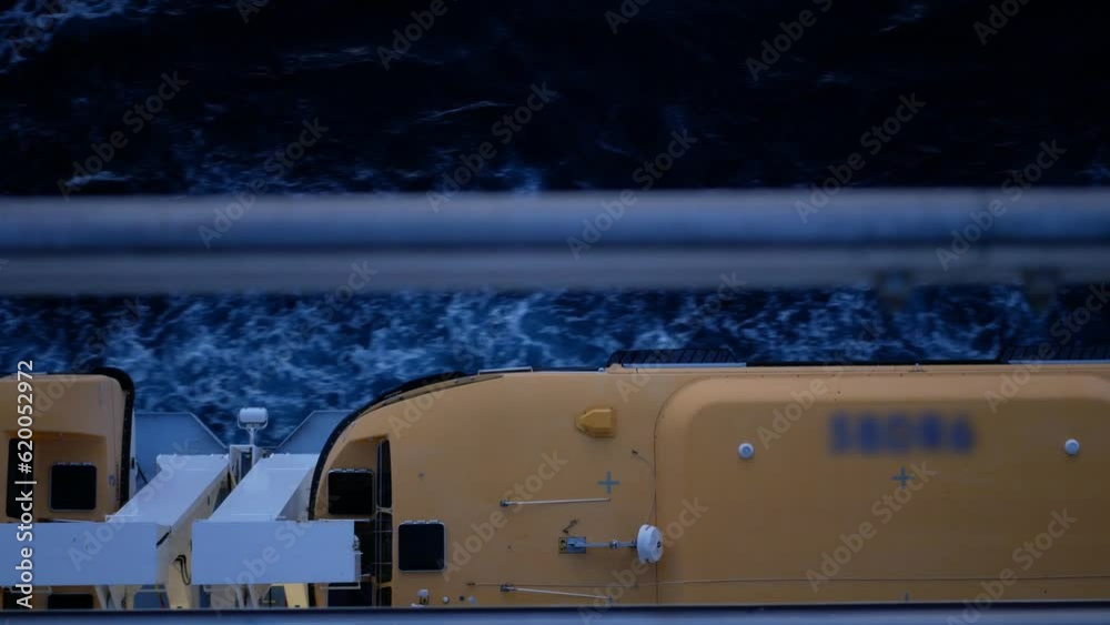 Stockvideo Lifeboat on giant cruise ship view down to ocean surface ...