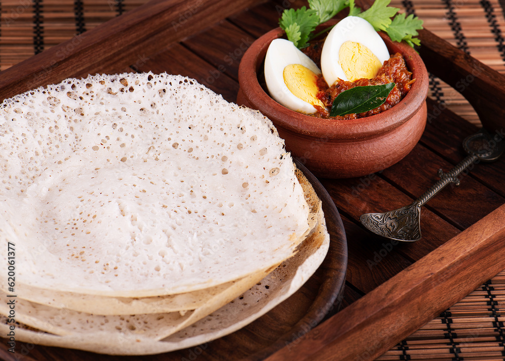 Egg curry with appam famous kerala food Stock Photo | Adobe Stock