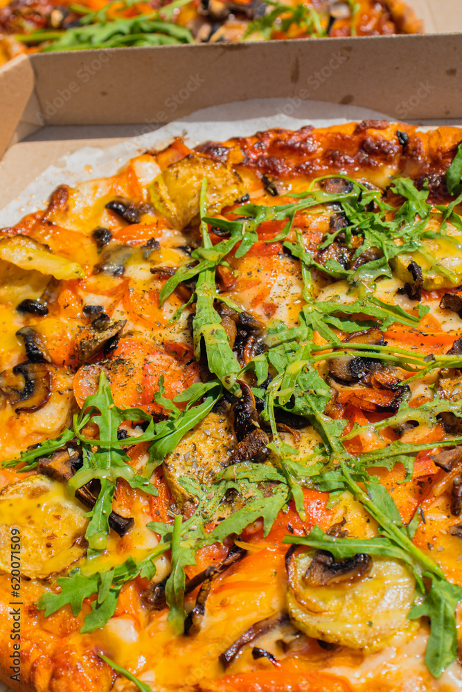 Two pan pizzas in two pizza boxes with their two different flavors ...