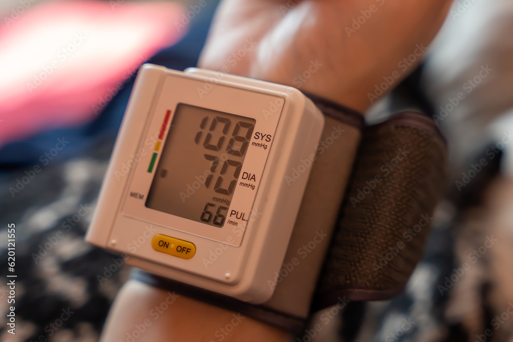 Blood pressure monitor on hand showing normal blood pressure Stock ...