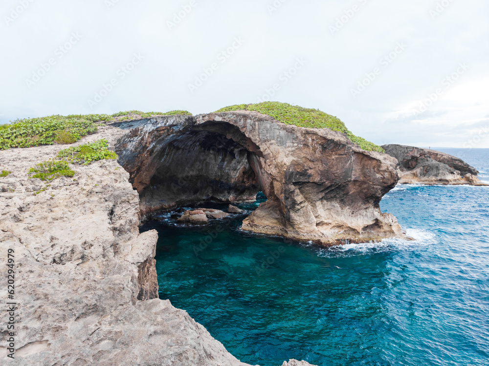 Cueva del indio coast landscape with rock arc shape formation at ...