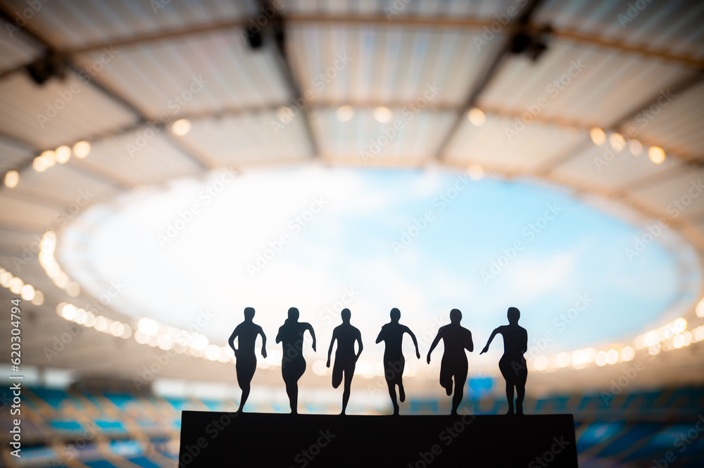 Silhouette of Six Sprinters Illuminate the Track at Modern Stadium ...