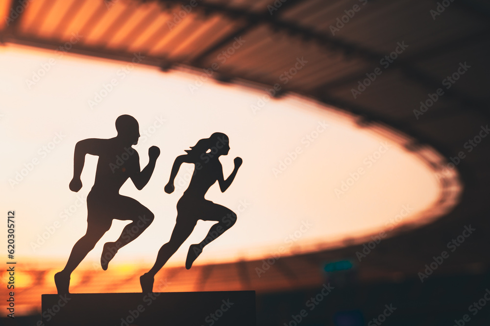 Synchronized Strides: Silhouettes of Male and Female Runners in Tandem ...