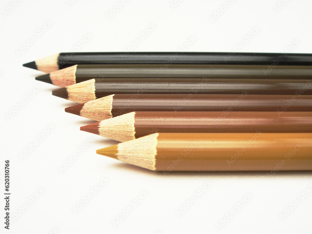 Soil colors colored pencils laid out in a gradation on white background ...