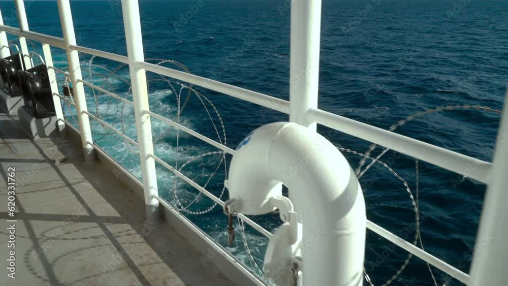 Barbed wire on railing deck of ship. Protection from pirates. Open deck ...
