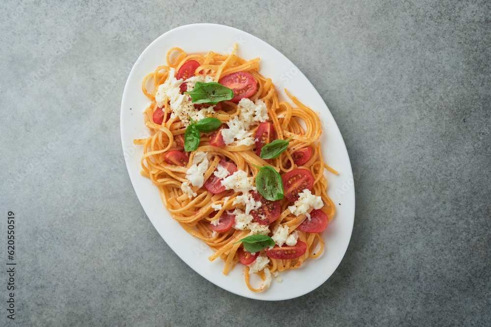 Salad caprese or pasta spaghetti broken with basil and mozzarella ala ...